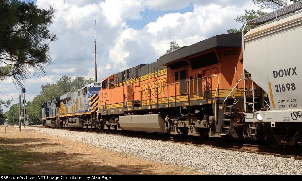CSX Monon Heritage C40-8W 7670 leads CREX ES44AC 1525 and BNSF 5722